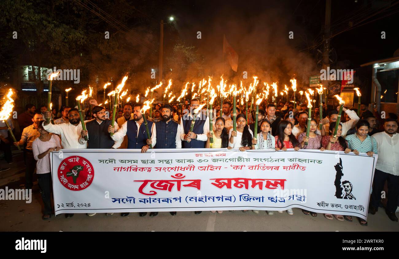 Members of the All Assam Students' Union (AASU) take part in a flaming ...