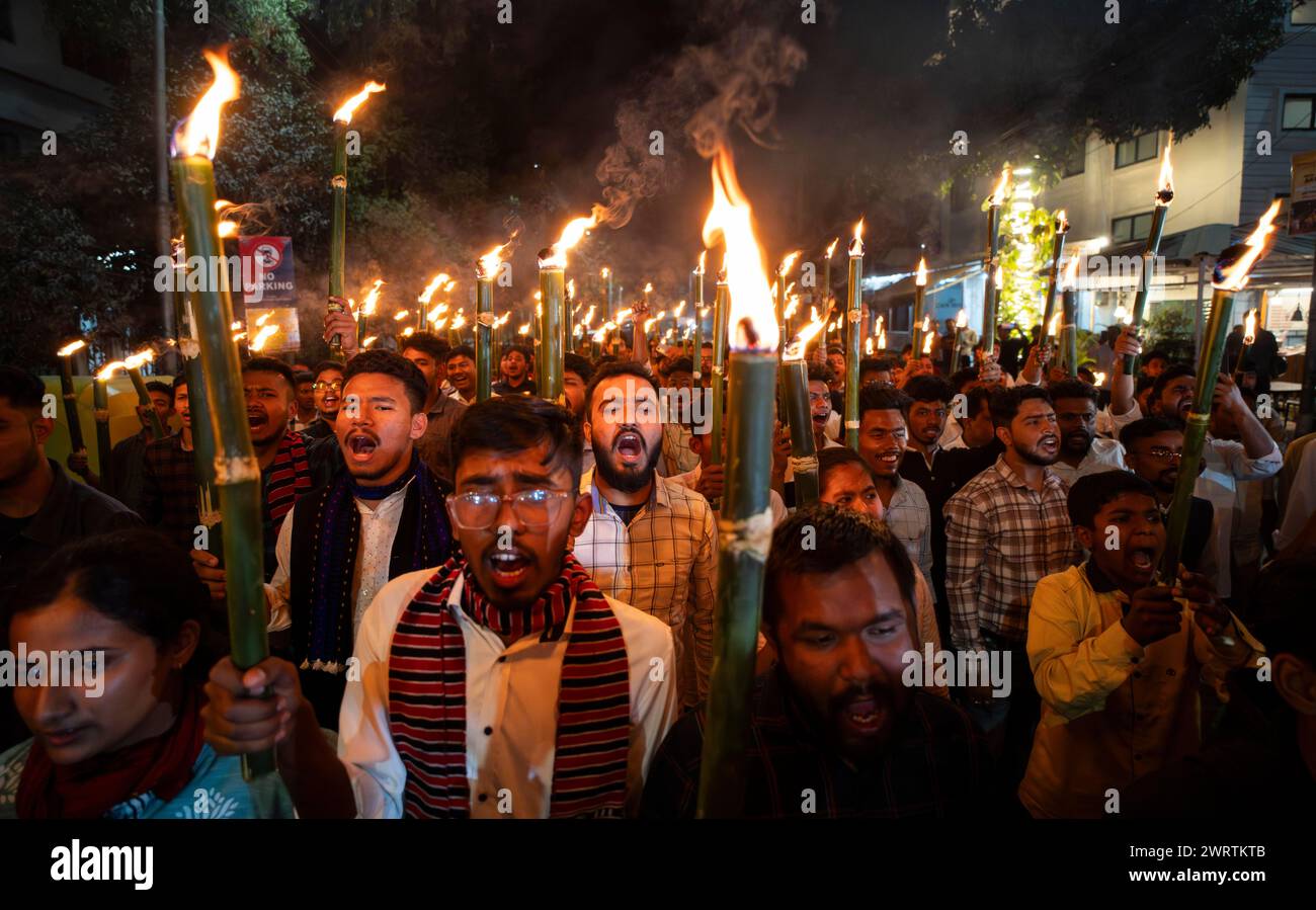 Members of the All Assam Students' Union (AASU) take part in a flaming ...
