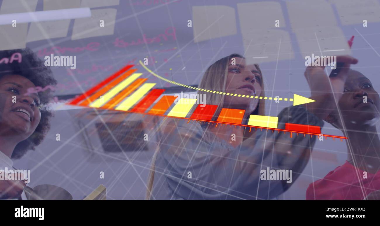 Image of falling graph, low angle view of diverse coworkers discussing ...