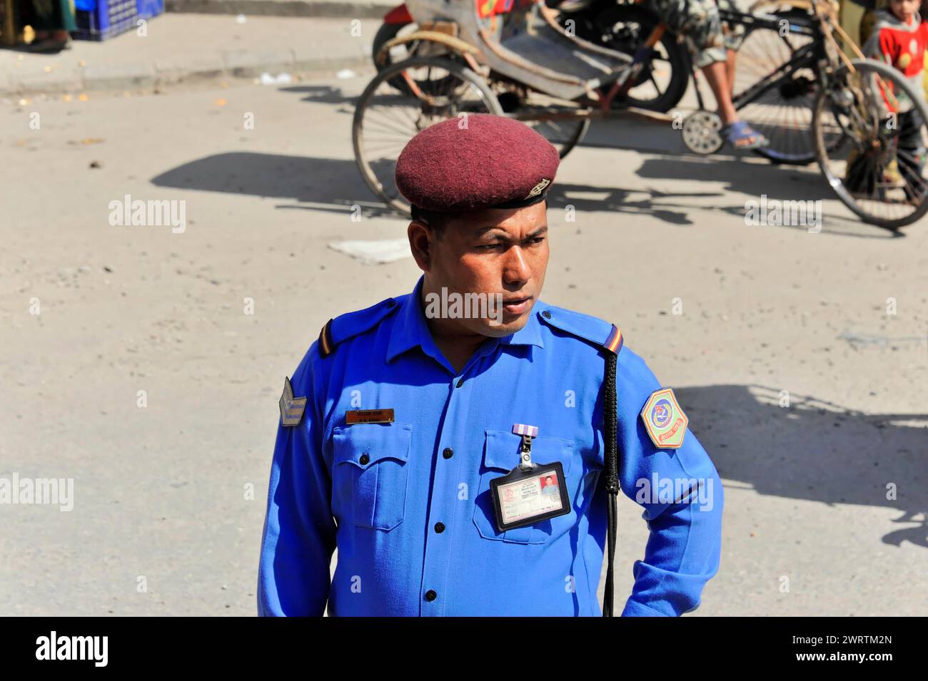 Security guard in uniform observes the action attentively, Bhairahawa ...