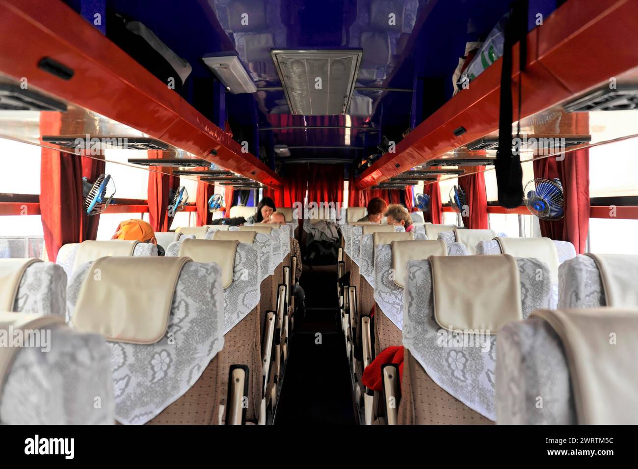 Interior view of a bus with rows of seats for travellers, Bhairahawa ...