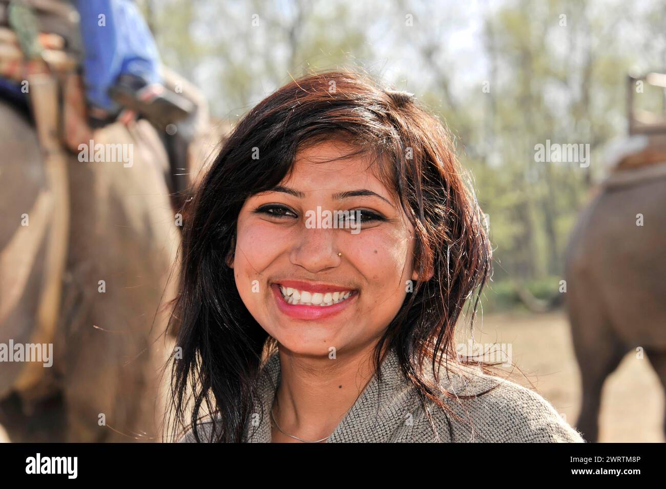 Portrait of a smiling woman with a gap in her teeth, Chitwan National ...