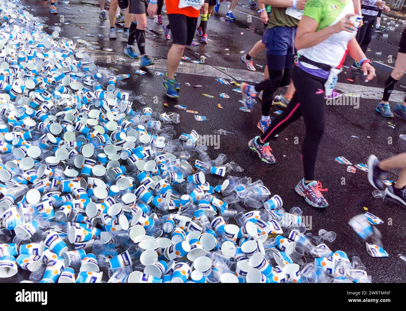 Empty drinking cups lying on the street along the marathon route ...