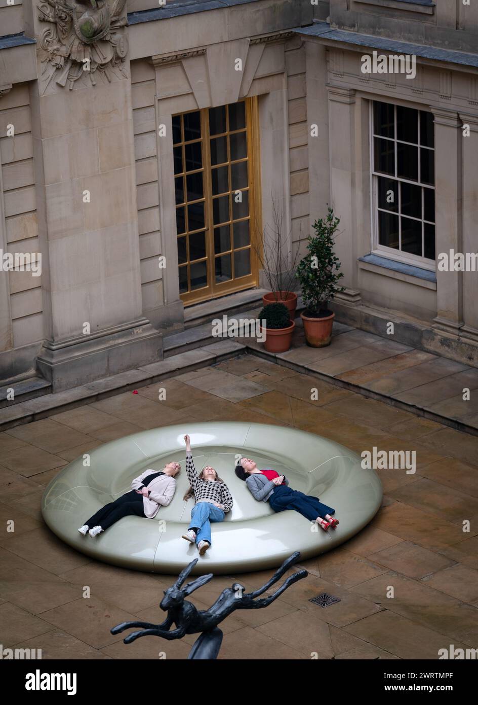 Left to right Lucy Ranfield, Ellie Bell and Gill Hart relax on an ...
