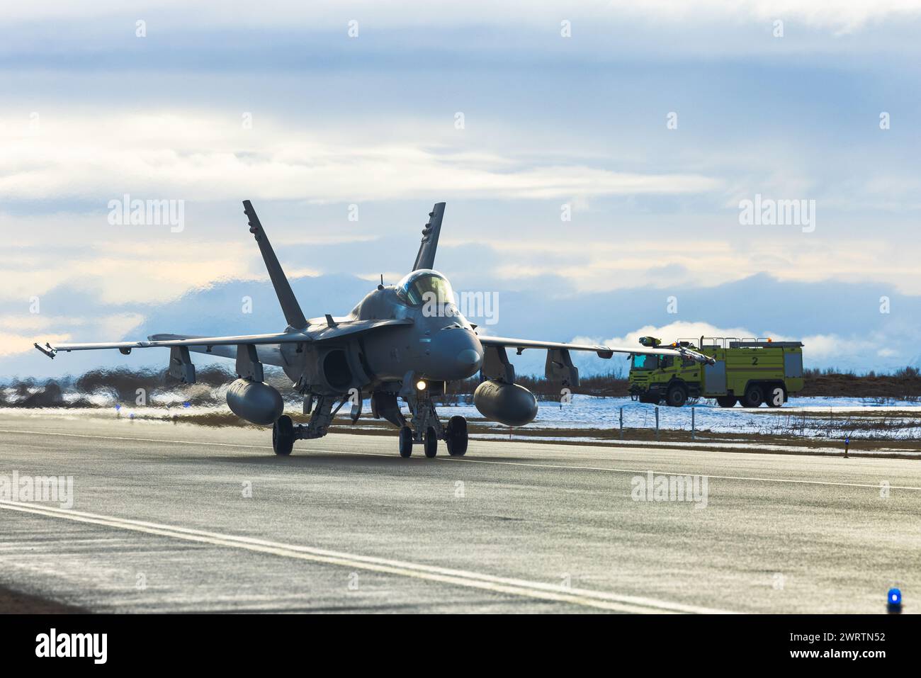 A Finnish Air Force F/A-18C Hornet pilot taxis on a Flightline to ...