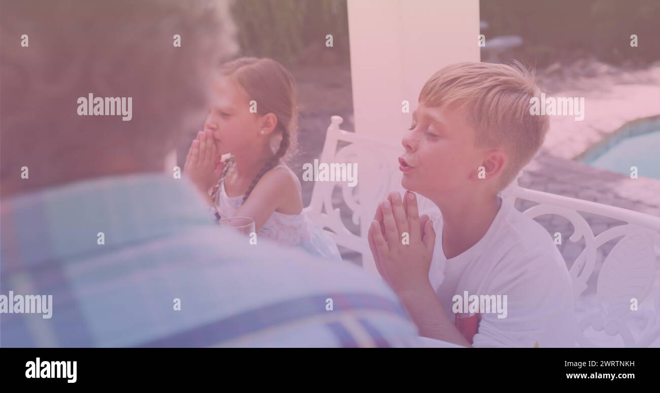 Image of caucasian family praying and having dinner Stock Photo - Alamy