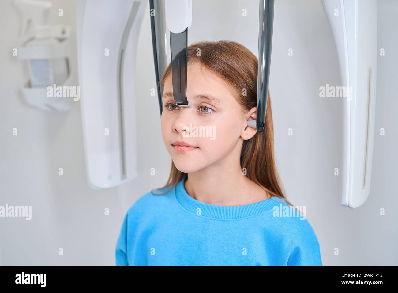 Young female patient is restrained for a dental x-ray Stock Photo - Alamy