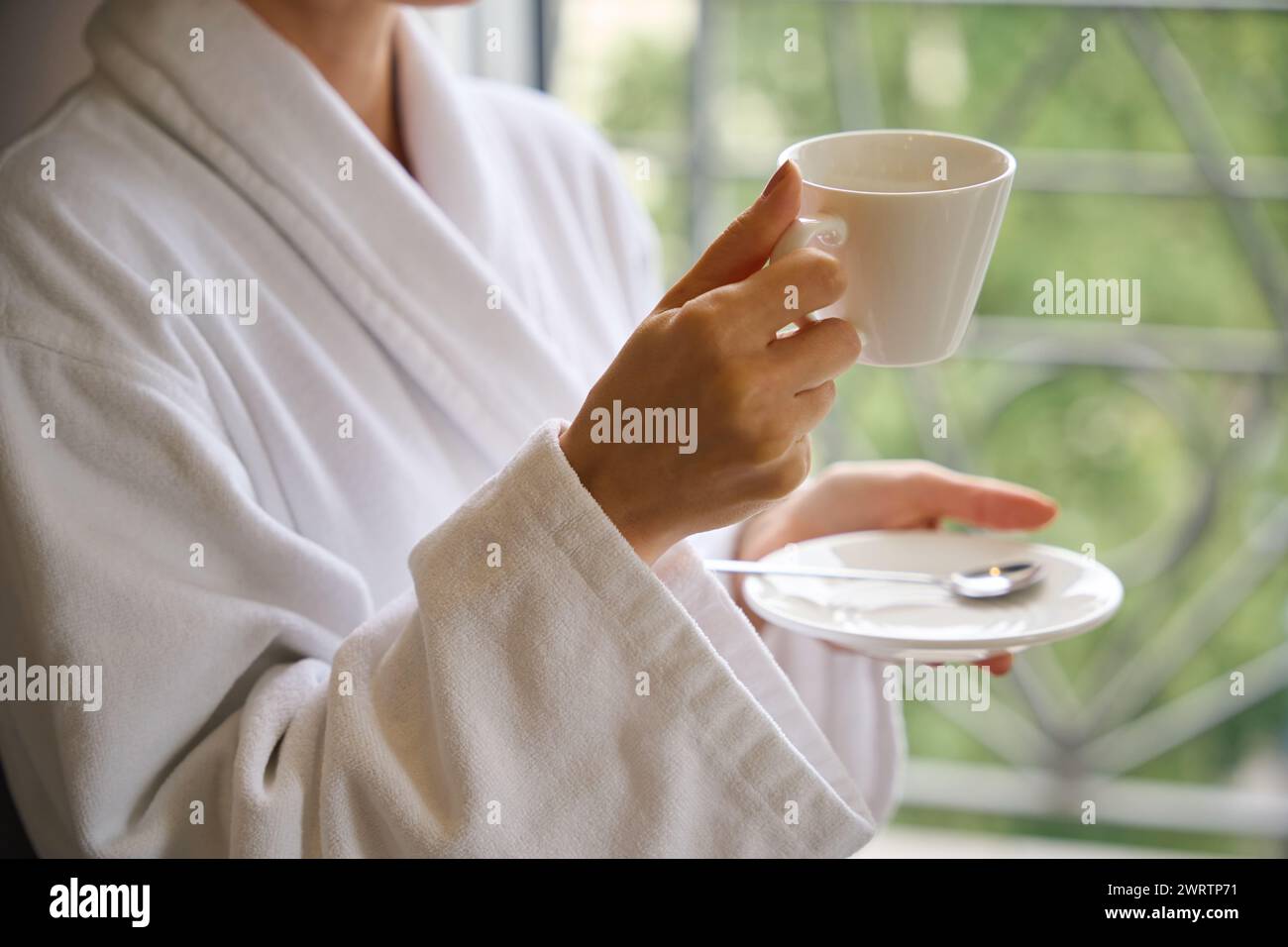Female person having refreshing morning coffee upon awakening Stock ...