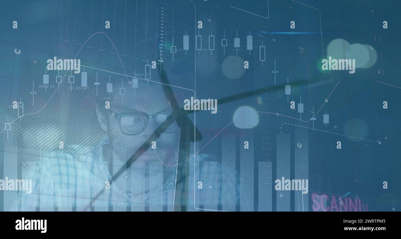 Image of graphs with wind turbines, caucasian tired businessman working ...