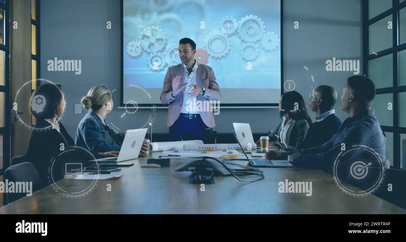 Image of icons over diverse business people Stock Photo - Alamy