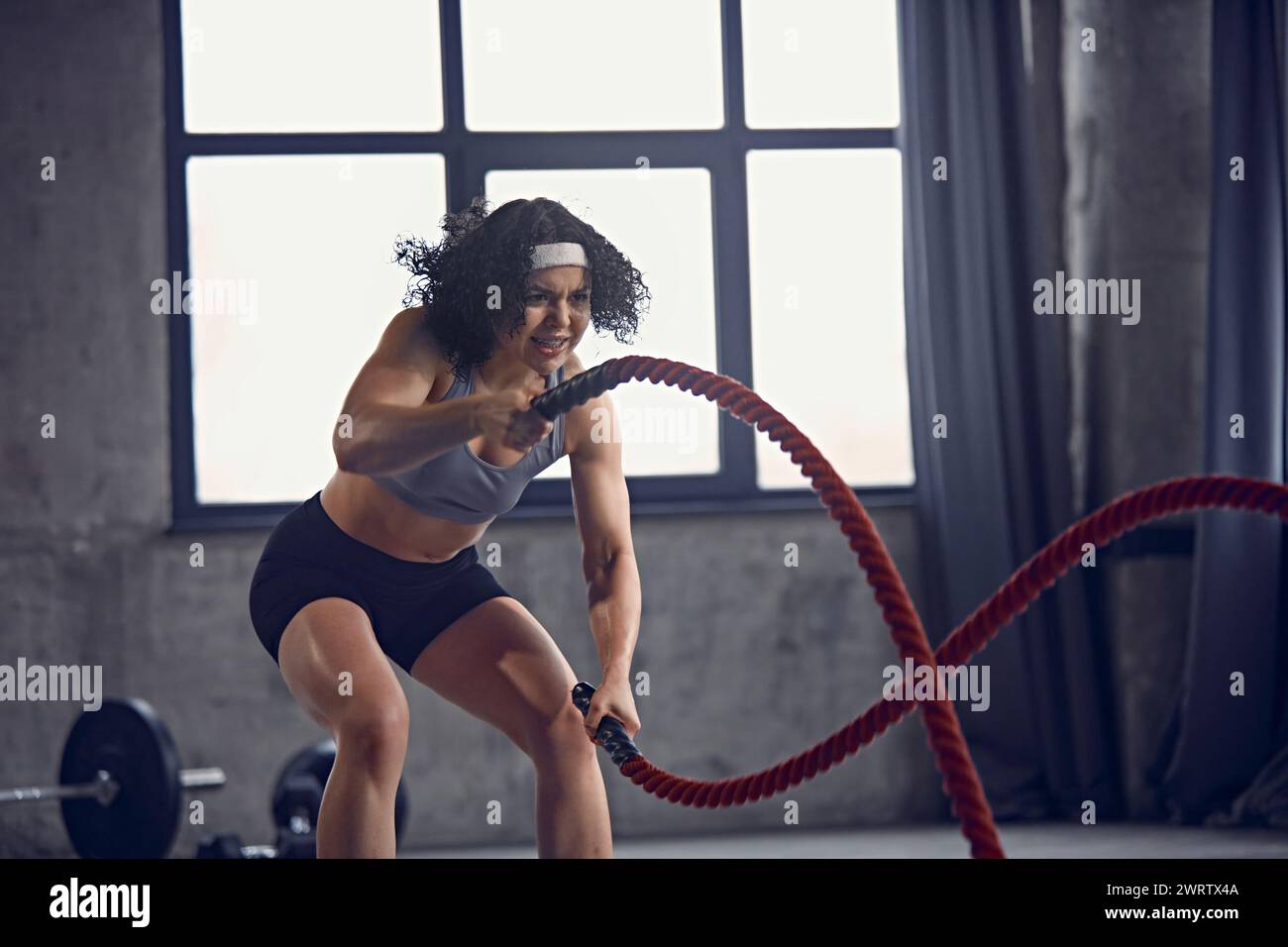 Dynamic portrait of athletic young women in sportswear doing high ...