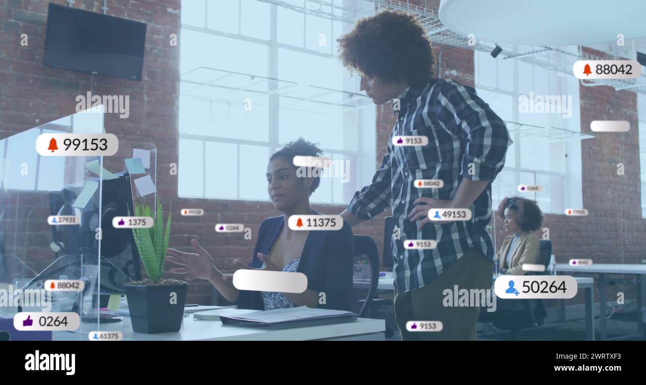 Image of notification bars over diverse coworkers discussing reports on computer in office Stock ...