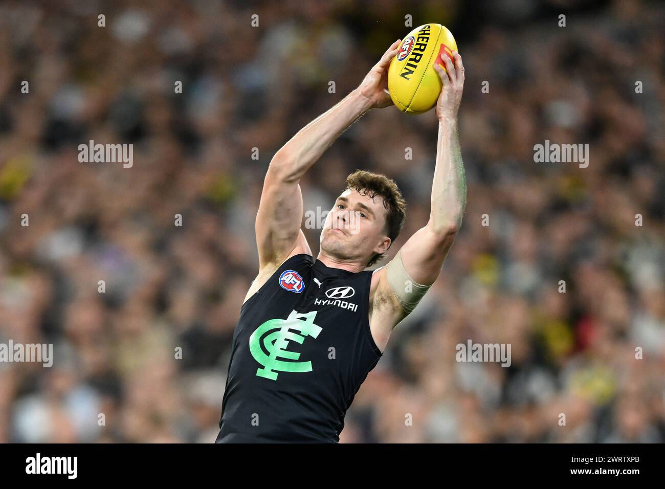 Melbourne, Australia. 14th Mar, 2024. Blake Acres of Carlton marks the ...