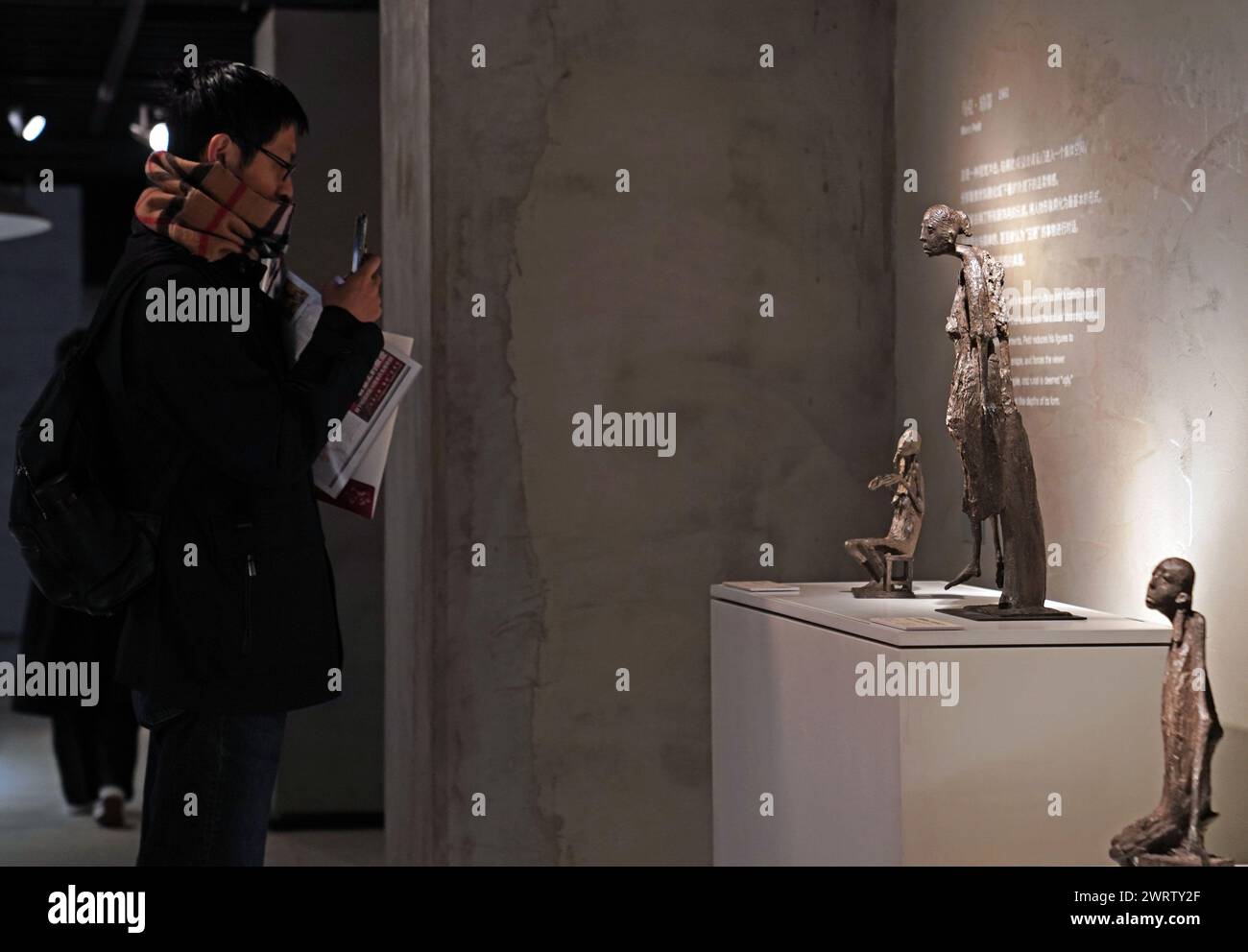 Shanghai, China. 14th Mar, 2024. A journalist takes photos of exhibits at the Liuli China Museum ...