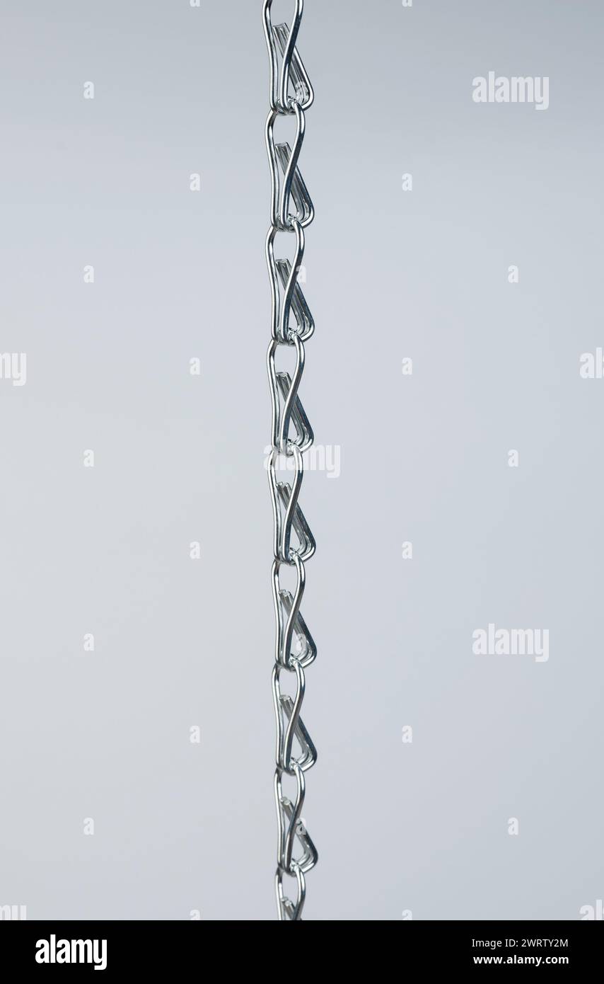 Metal link chain straight line isolated on white studio background ...
