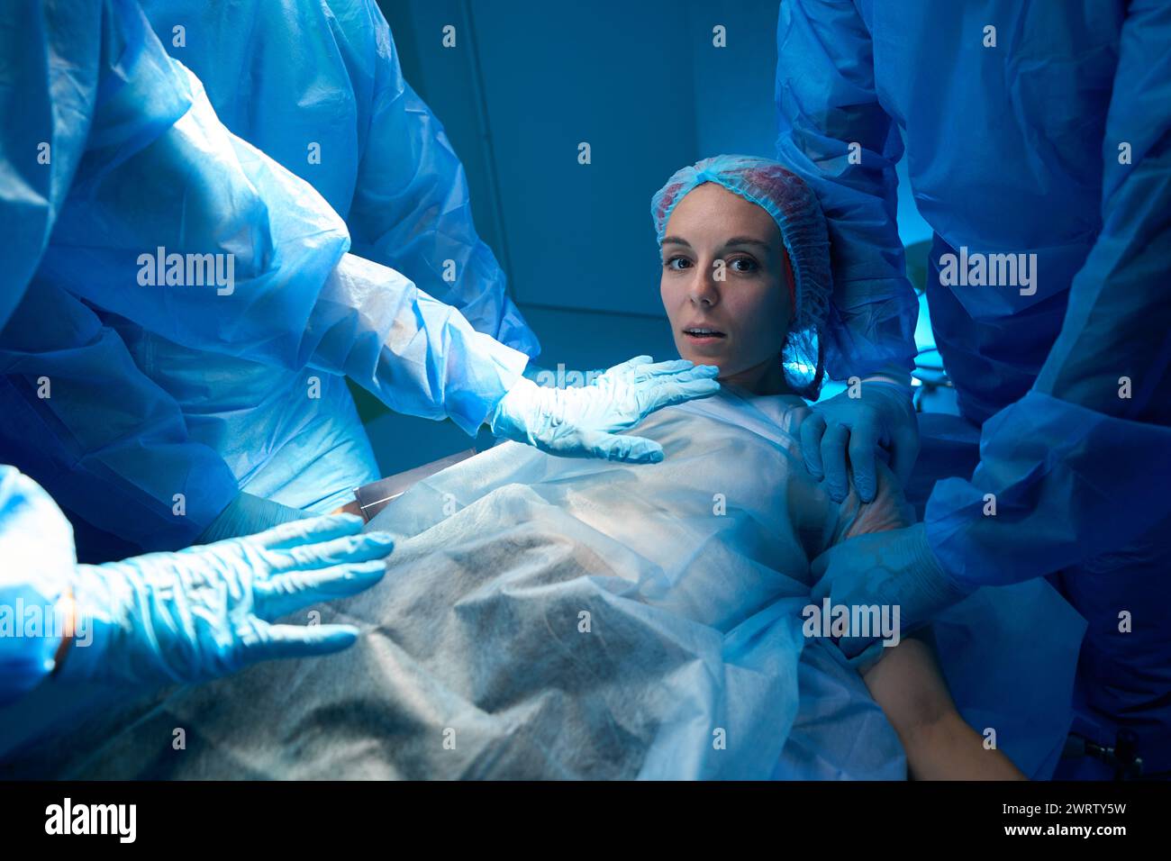 Scared emotional patient waking up during the operation Stock Photo - Alamy