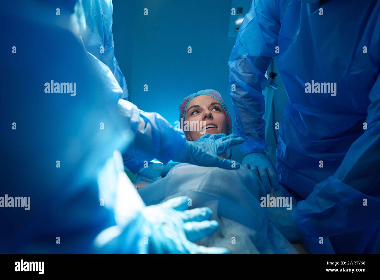 Woman patient waking up after operation in operating theater Stock ...