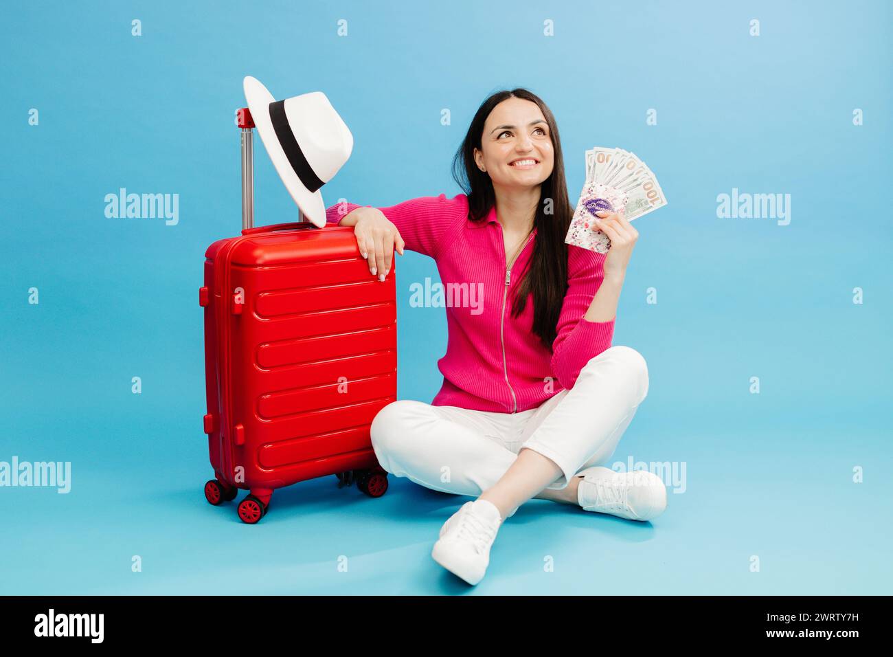 Traveler tourist woman in casual clothes and white hat holding money ...