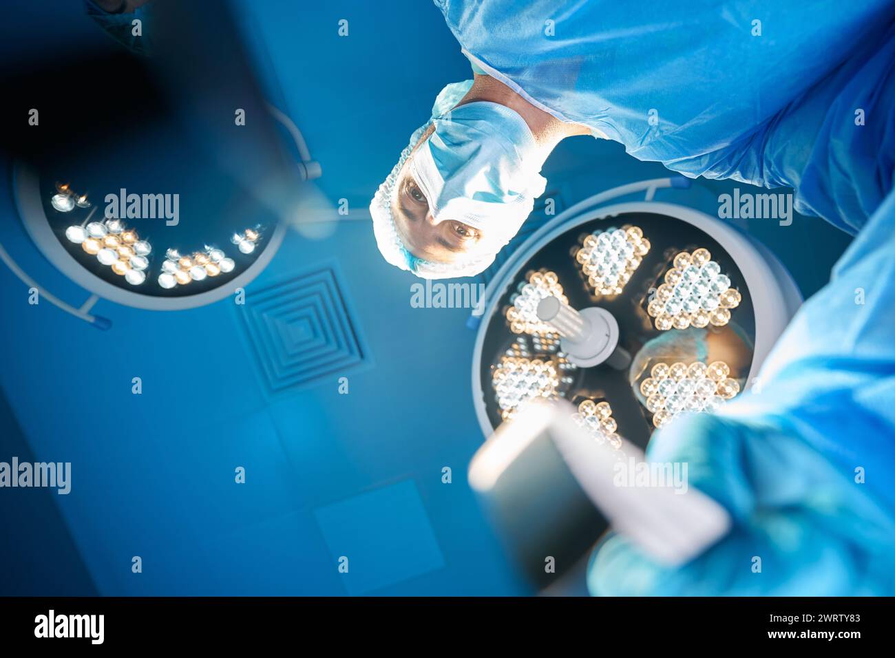 Surgeon standing above of patient before surgery Stock Photo - Alamy