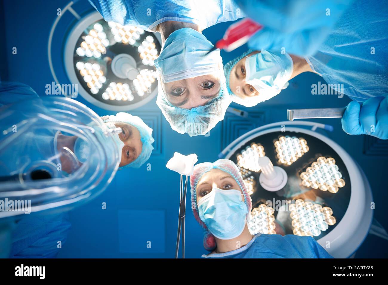 Group doctors perform operation patient hi-res stock photography and images - Alamy