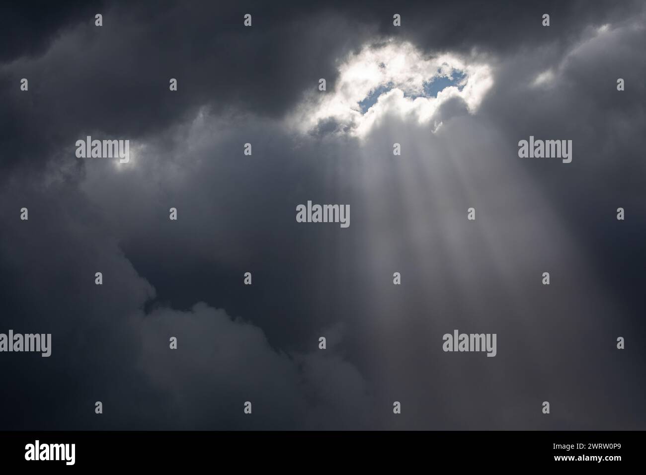 Sun burst through storm clouds, uk Stock Photo - Alamy
