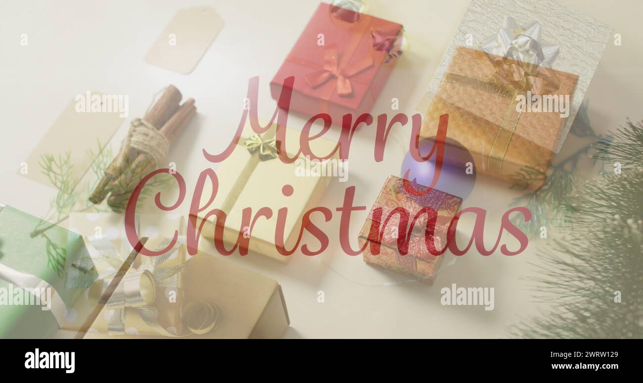 Image of christmas greetings text over christmas presents and ...
