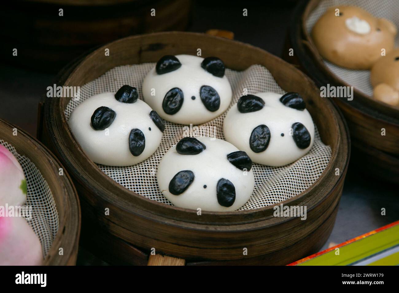 Bamboo bowl with Chinese steamed, buns, Panda-man and Butachan-man ...