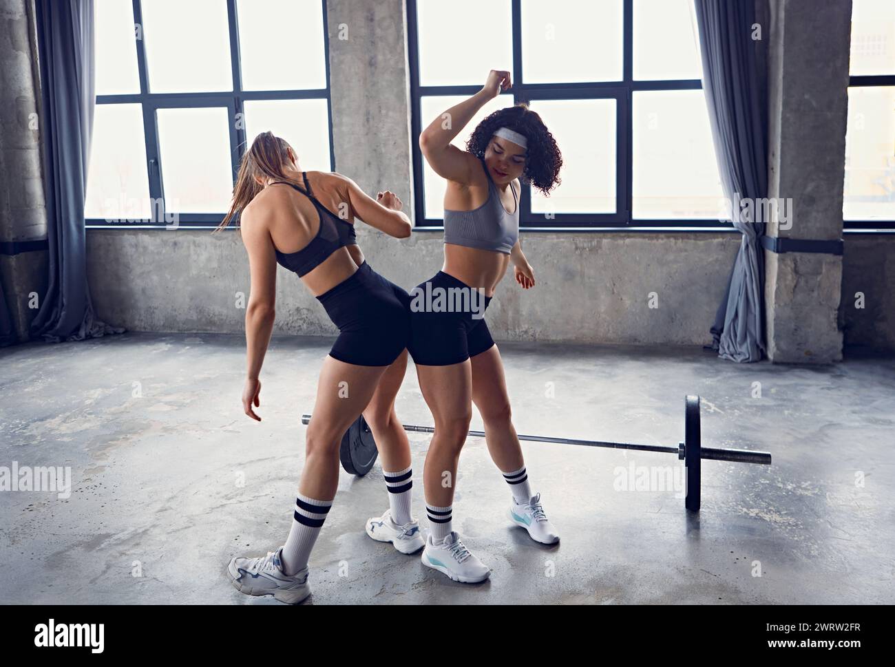 Encouragement and teamwork. Two women fitness partners celebrate after ...