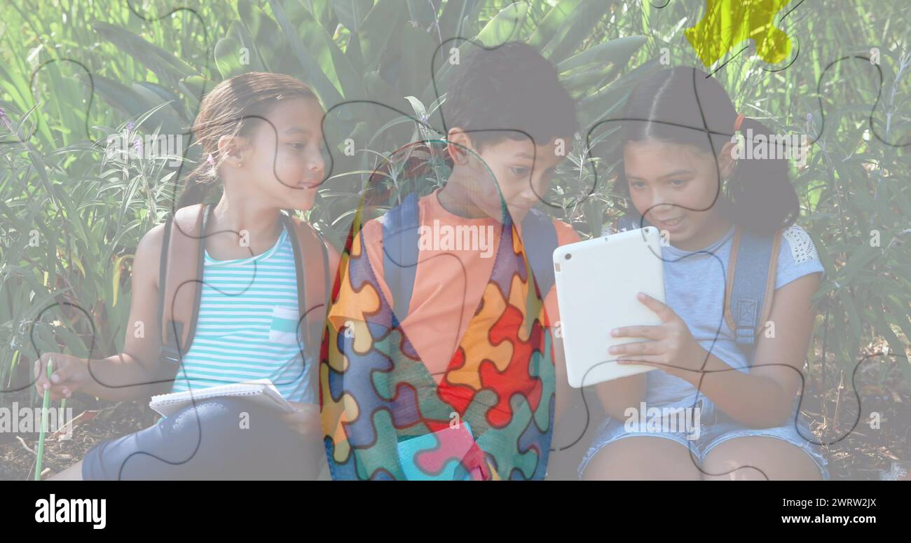 Image of colourful puzzle pieces over kids friends using electronic ...