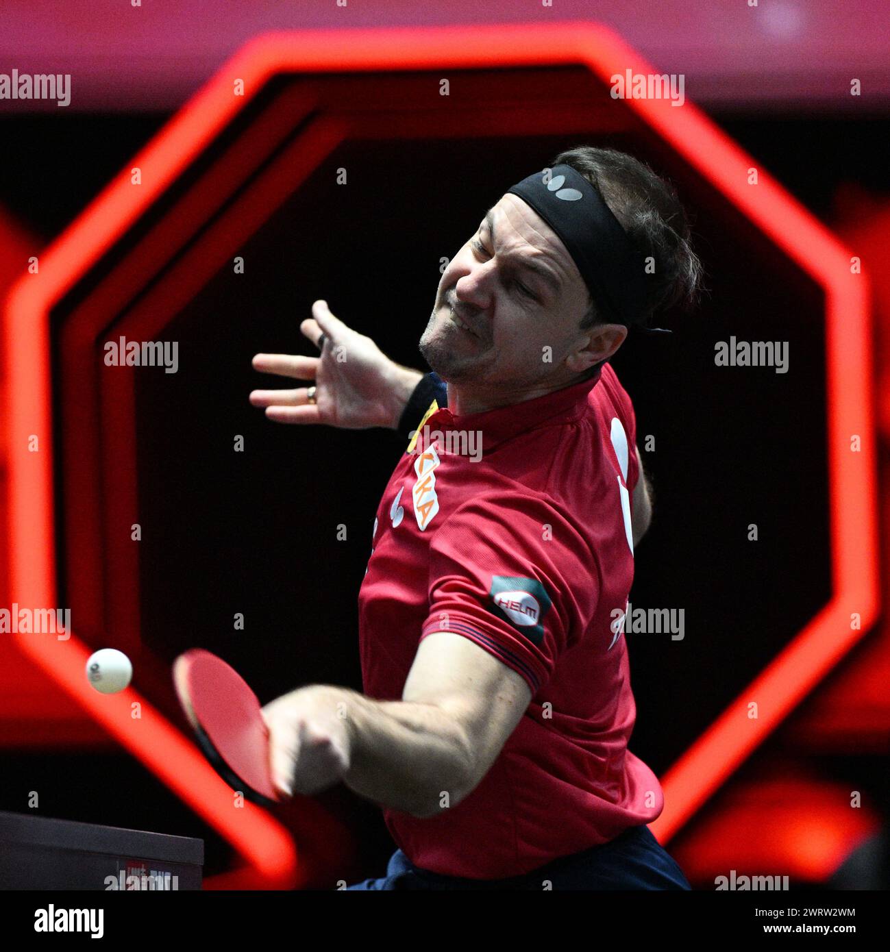 Singapore. 14th Mar, 2024. Timo Boll of Germany hits a return during ...