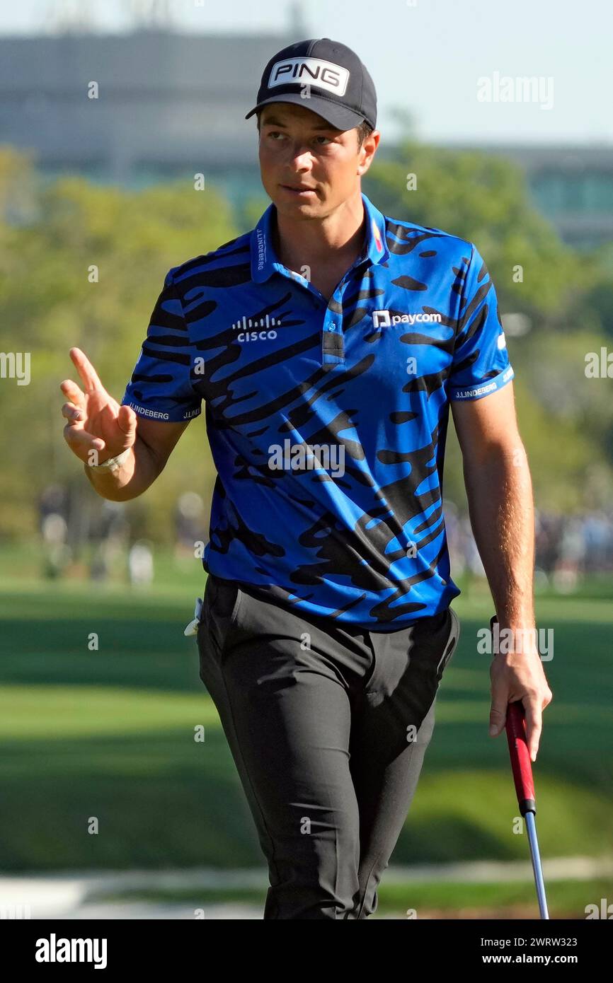 Viktor Hovland, of Norway, reacts after his birdie putt on the 14th ...