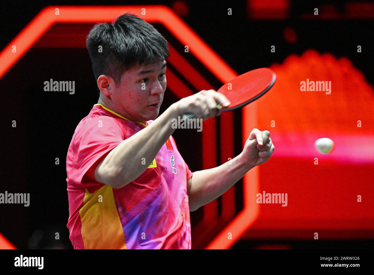 Singapore. 14th Mar, 2024. Lin Shidong of China hits a return during ...