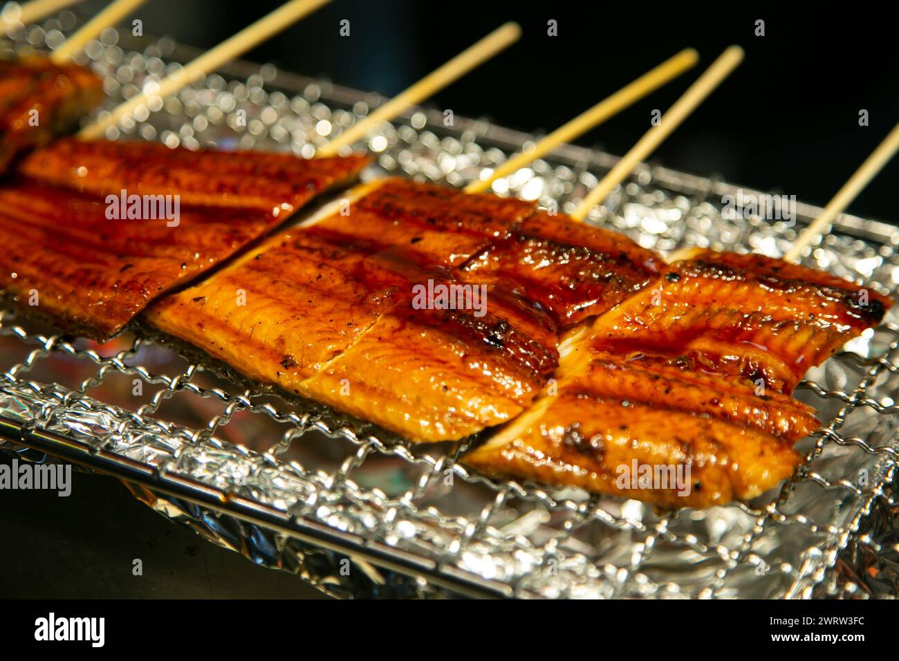 Smoked japanese eel in a market stall in Nishiki fish market in Kyoto ...