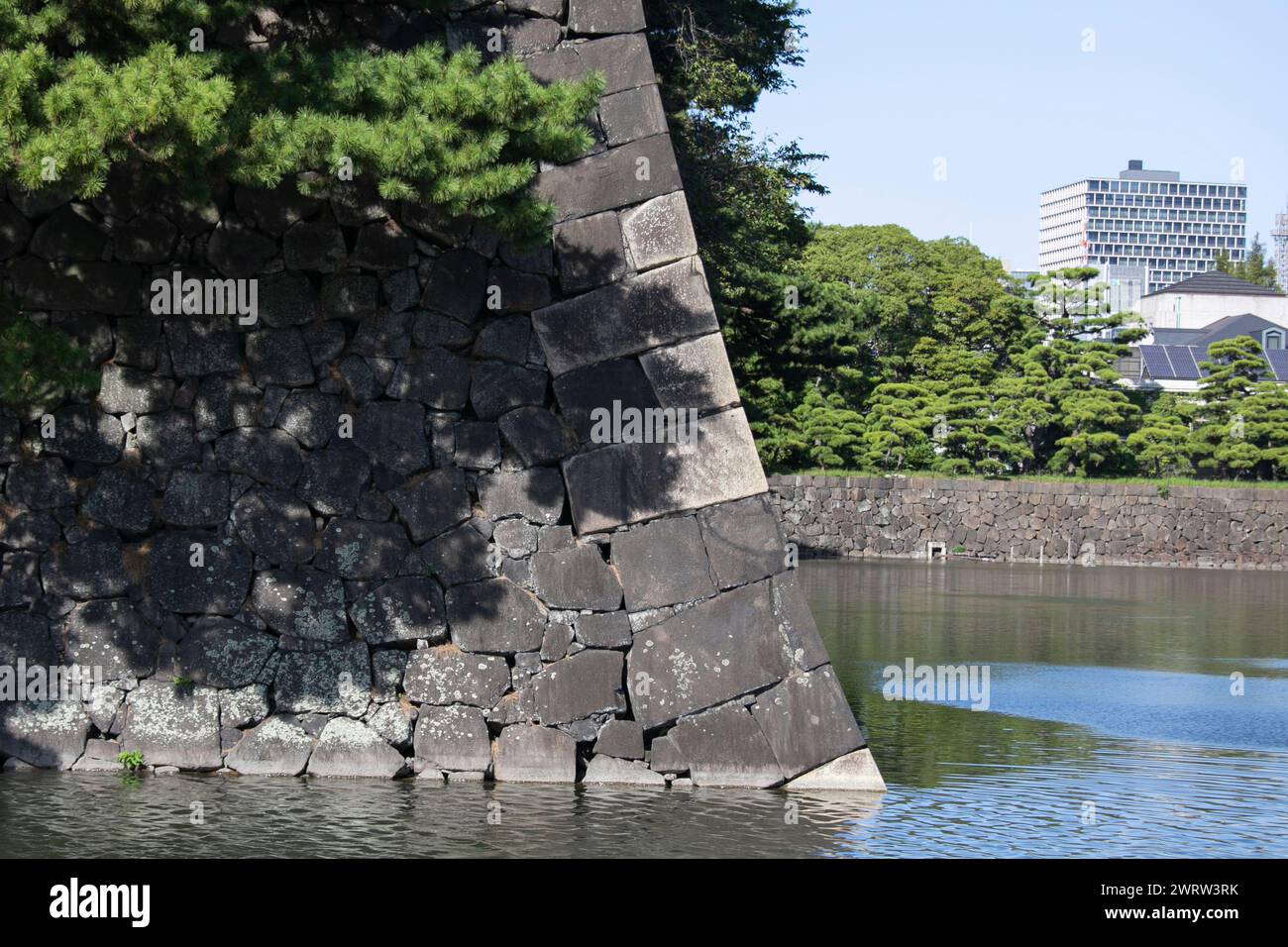 In the Japanese Imperial Palace in Tokyo, Japan, massive stone walls ...