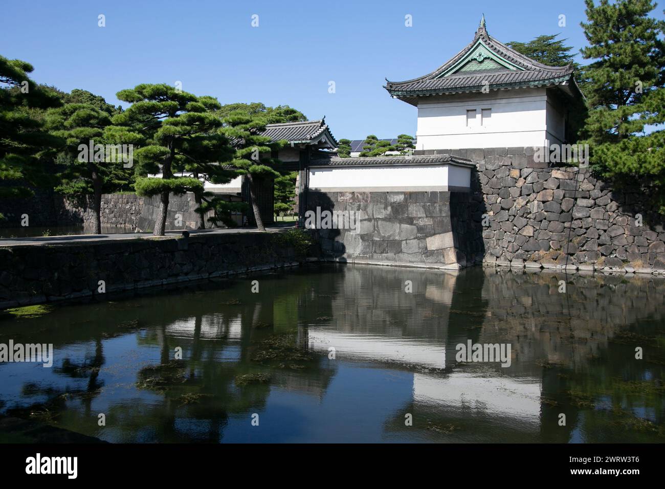 In the Japanese Imperial Palace in Tokyo, Japan, massive stone walls ...