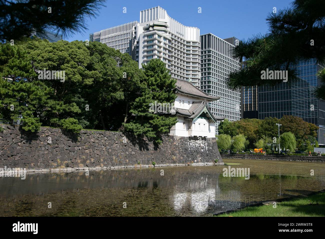 In the Japanese Imperial Palace in Tokyo, Japan, massive stone walls ...