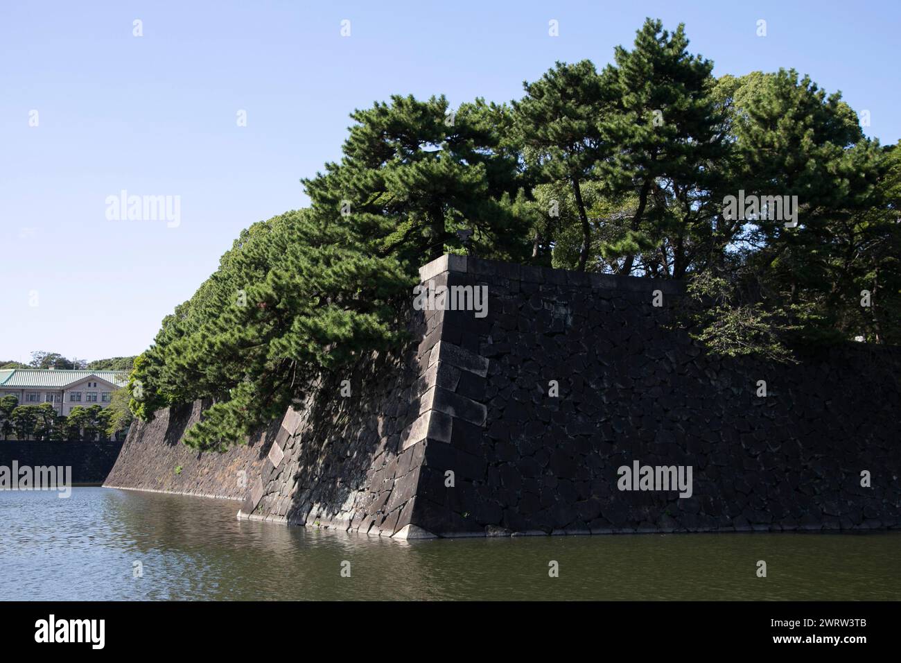 In the Japanese Imperial Palace in Tokyo, Japan, massive stone walls ...