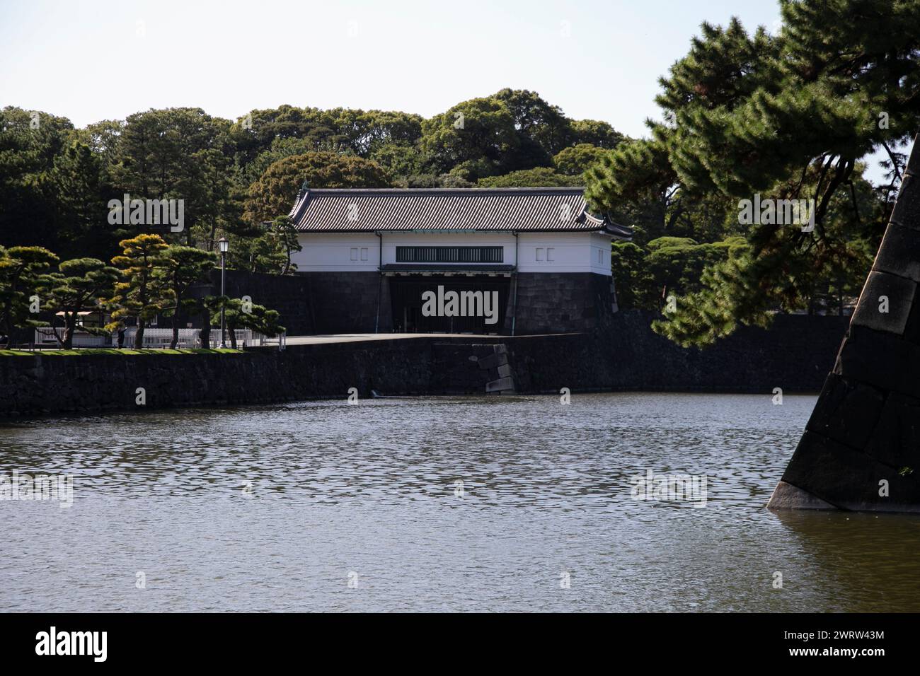 In the Japanese Imperial Palace in Tokyo, Japan, massive stone walls ...