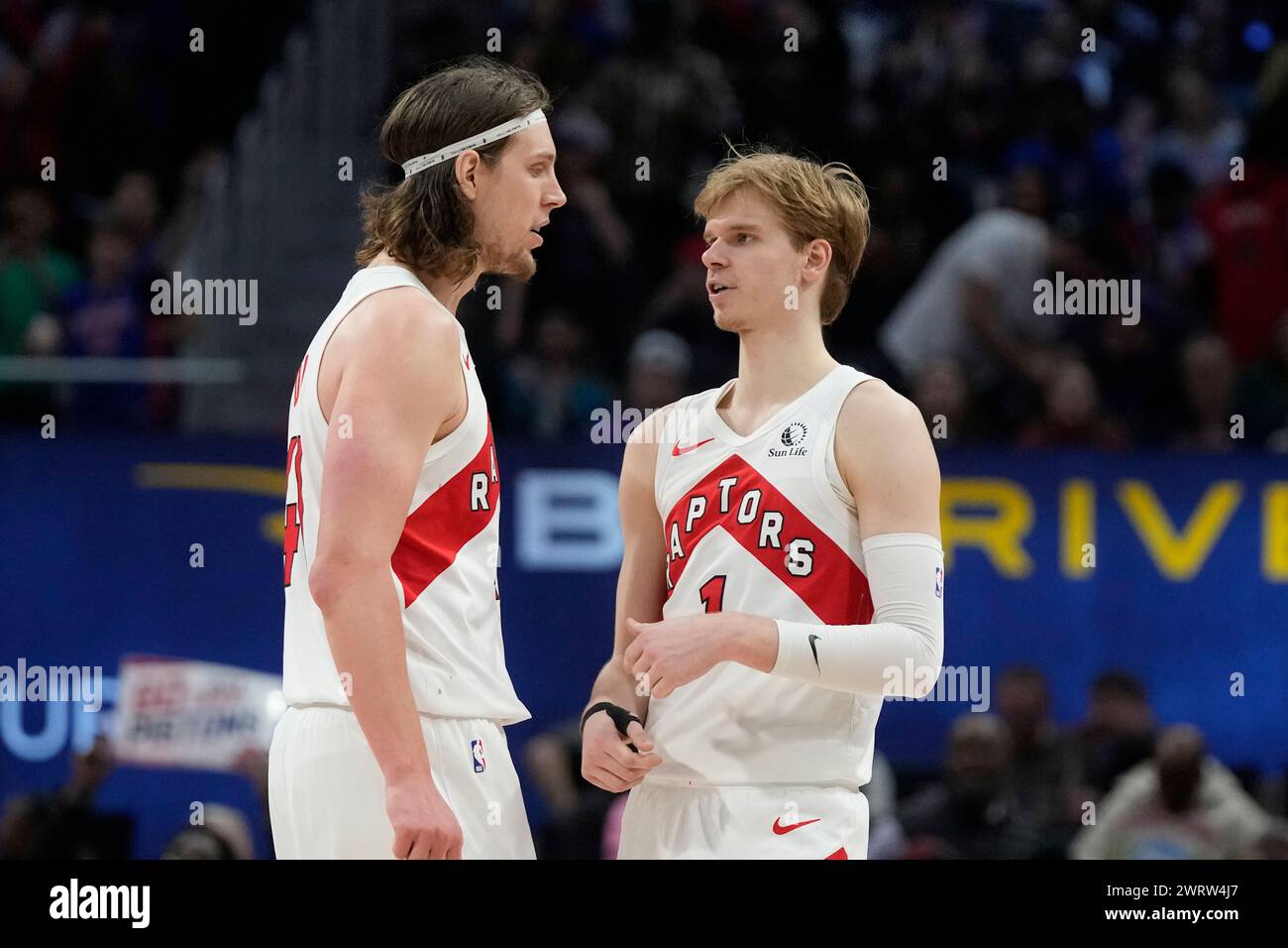 Toronto Raptors forward Kelly Olynyk, left, talks with guard Gradey ...