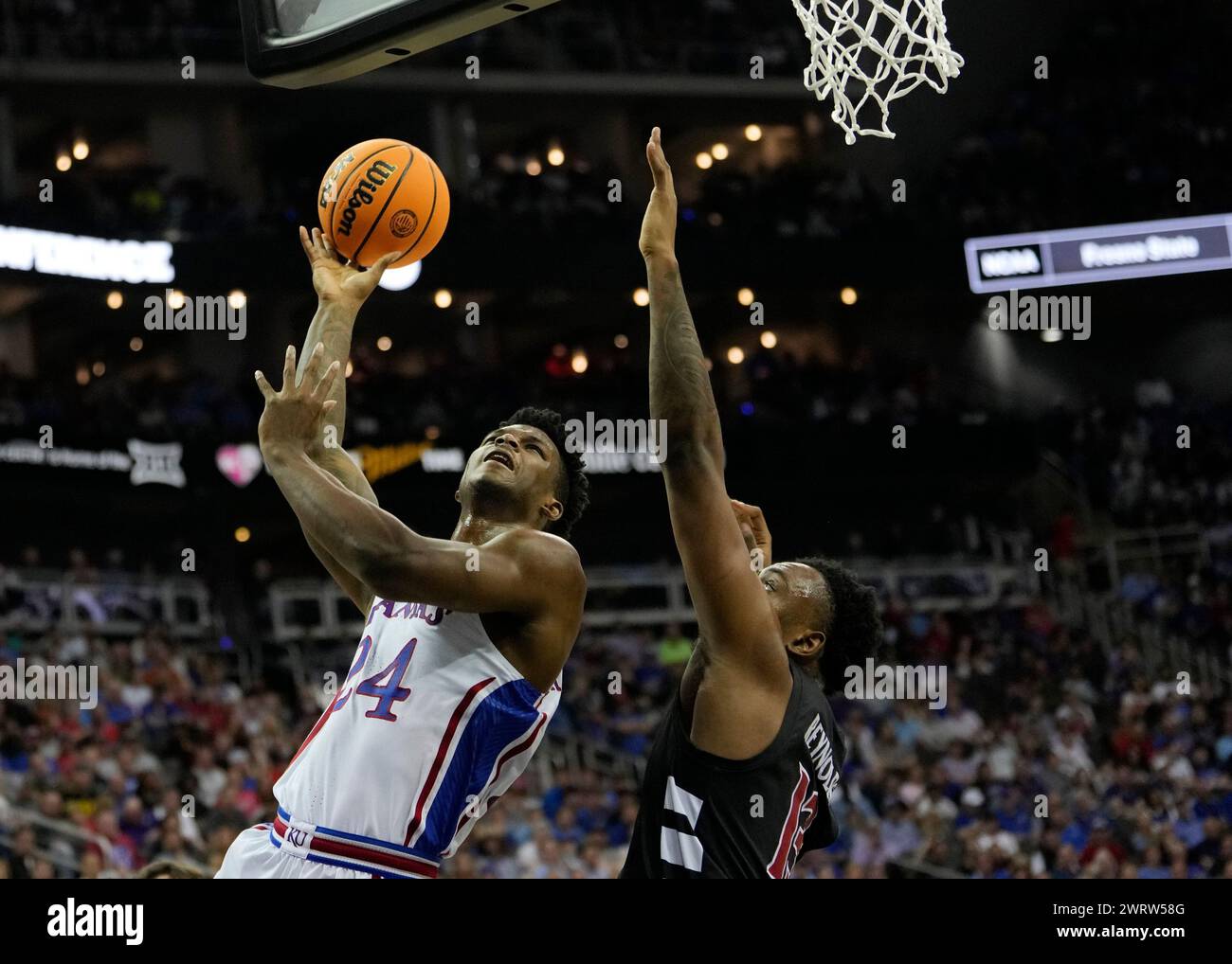 MAR 13 2024: Kansas Jayhawks forward K.J. Adams Jr. (24) drives to the ...