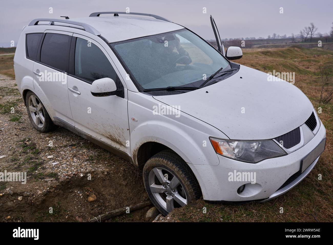 Off road SUV car crashed into a ditch on a track course Stock Photo - Alamy