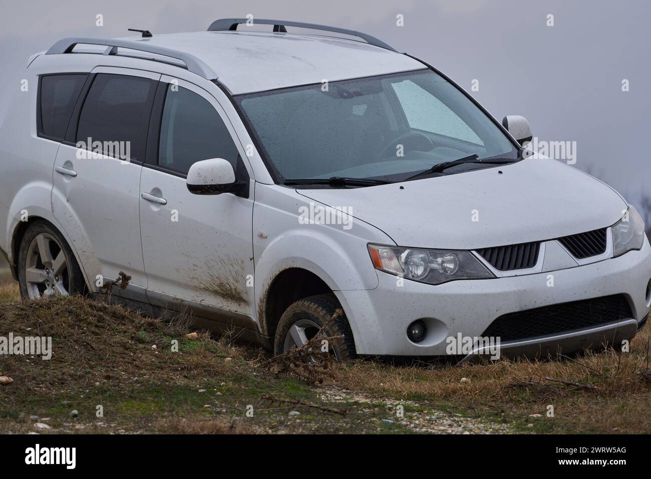 Off road SUV car crashed into a ditch on a track course Stock Photo - Alamy