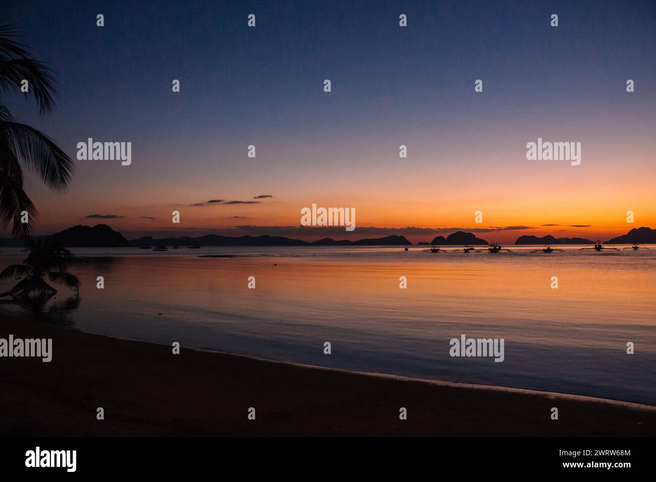 Scenic sunset on tropical beach. Aerial view of dramatic evening sky ...