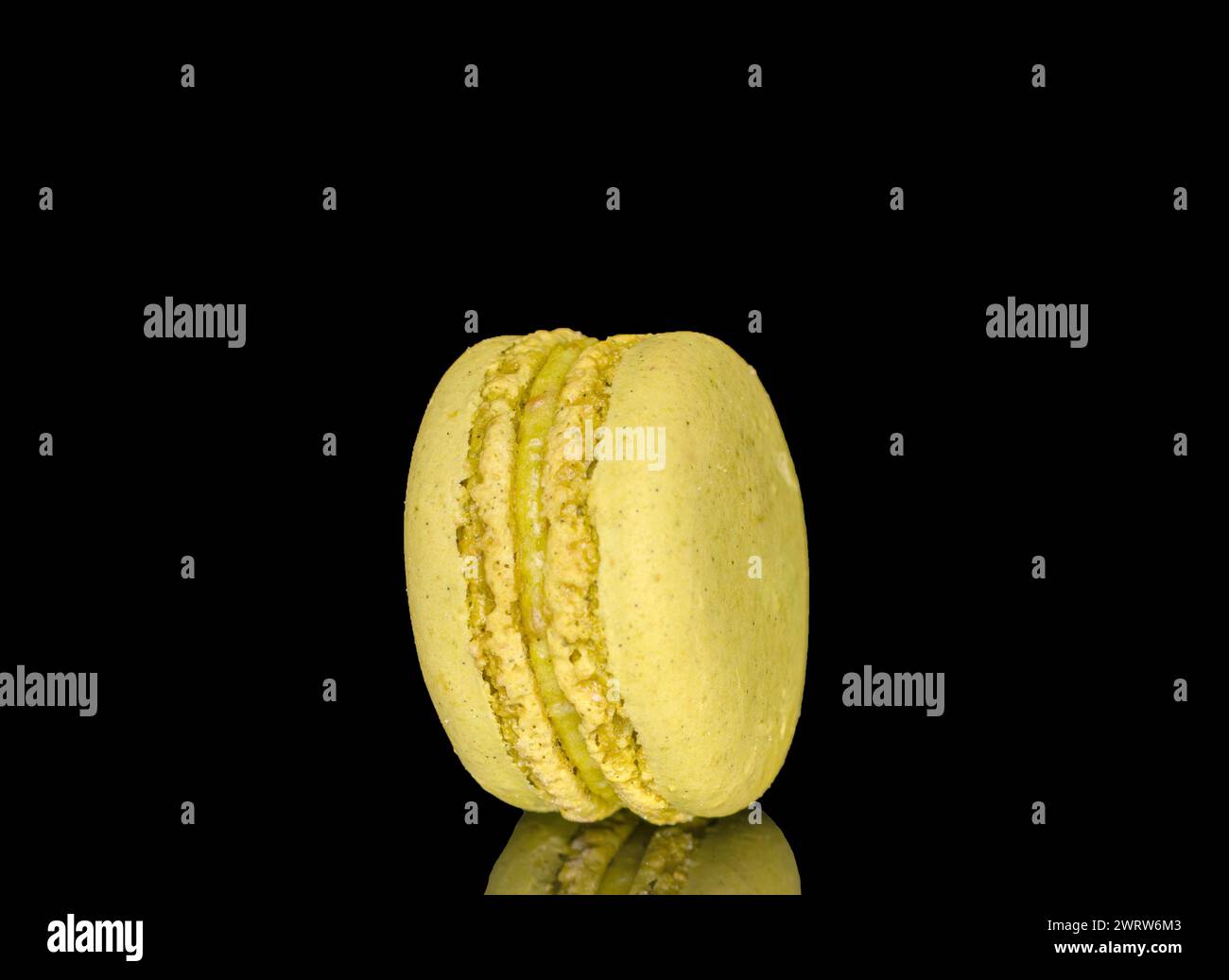 One sweet macaron, macro, isolated on black background Stock Photo - Alamy