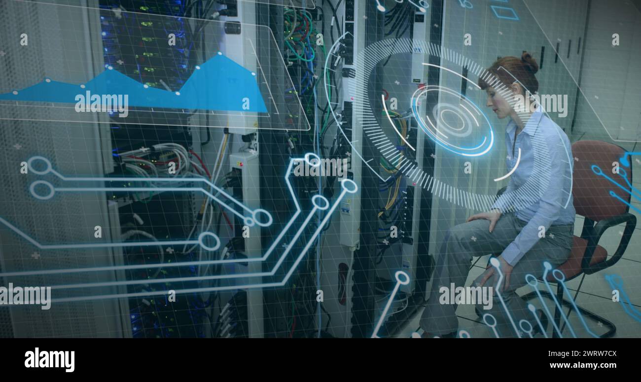 Image of interface with data processing over caucasian female engineer working at server room ...