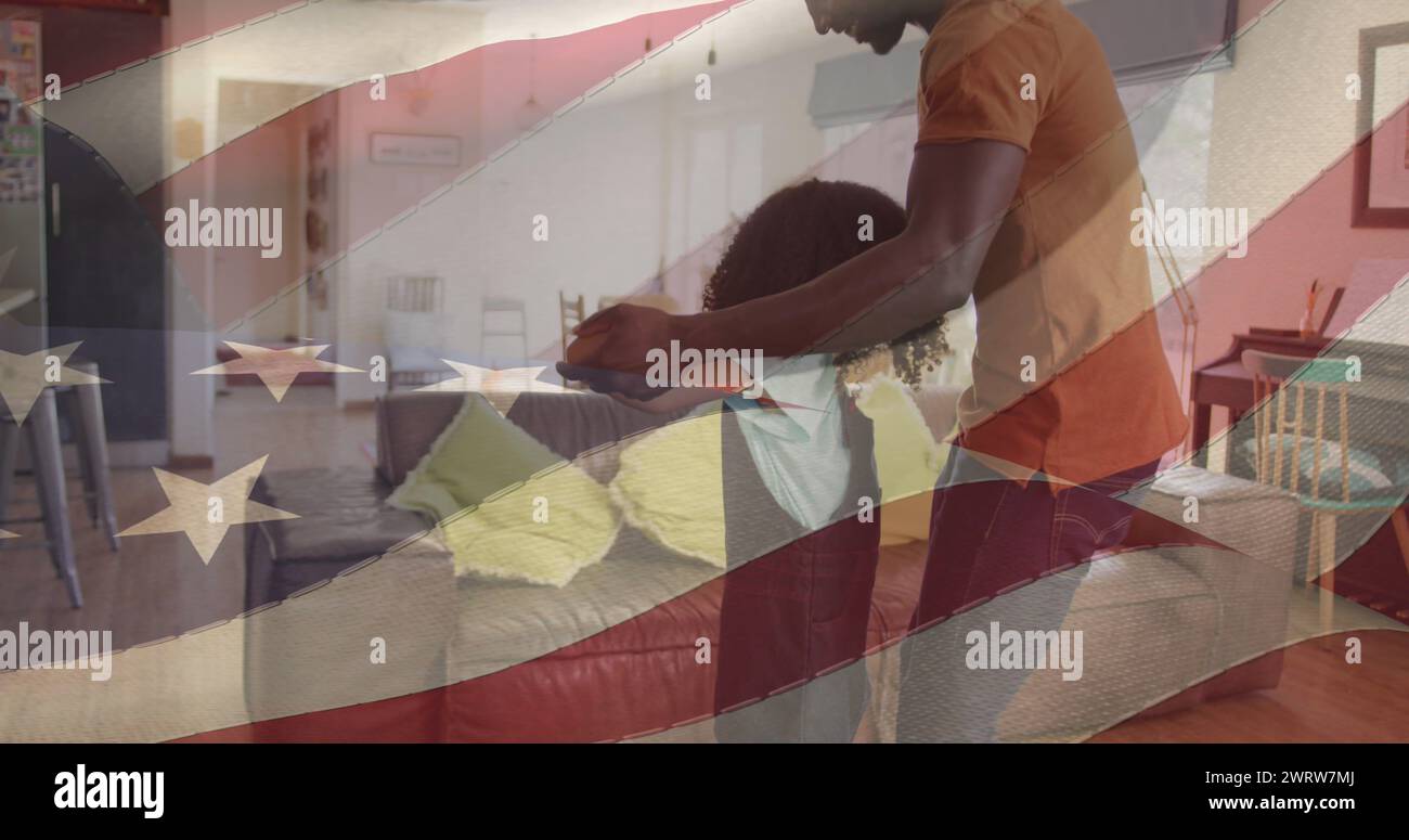 Image of flag of usa waving over african american father dancing with ...