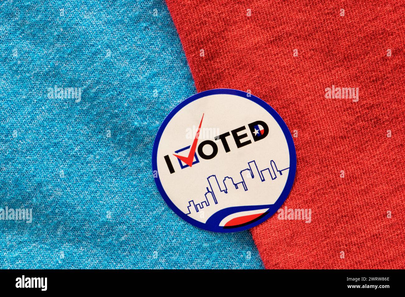 I Voted sticker split between red and blue materials indicating both ...
