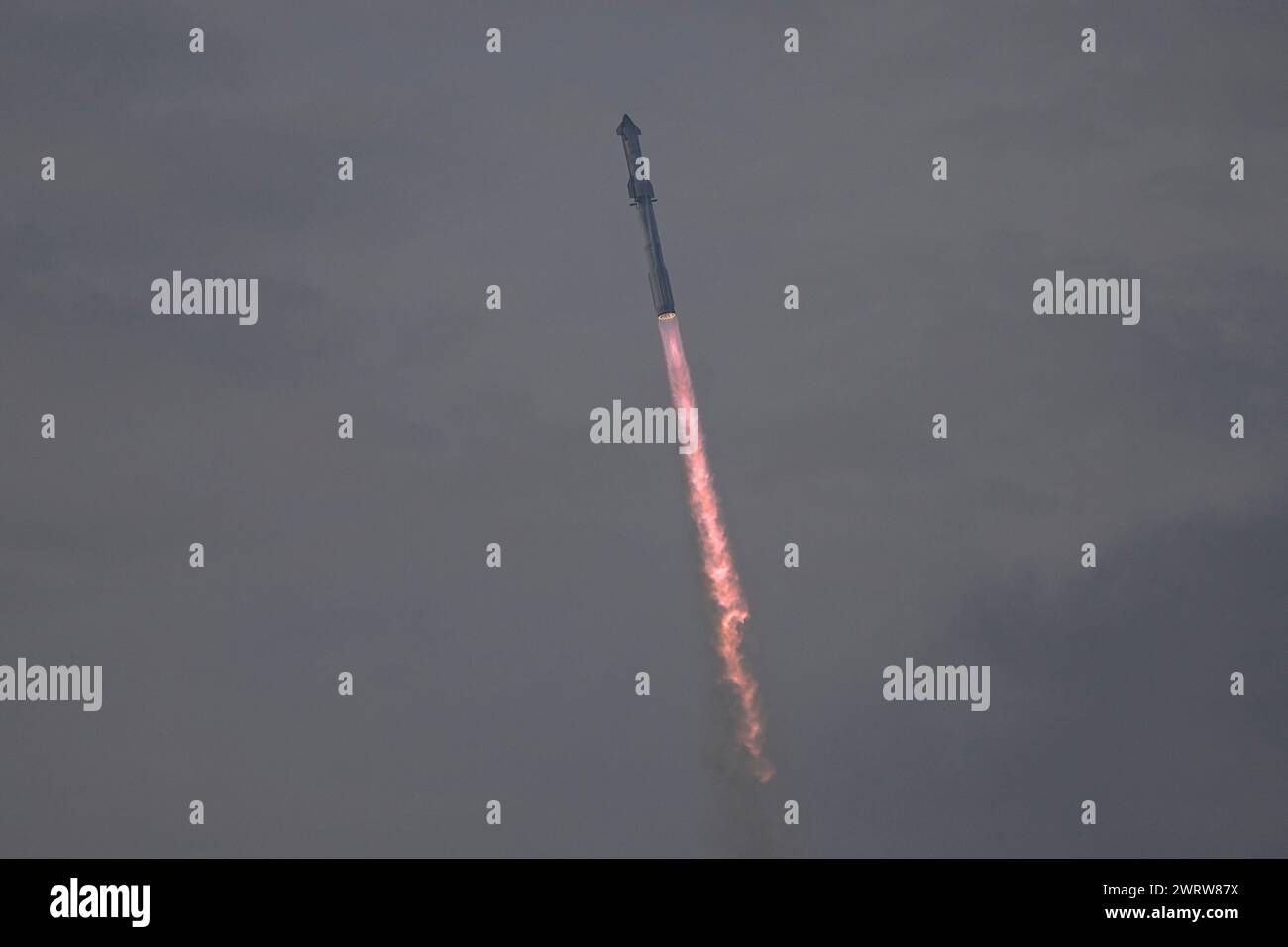 SpaceX's mega rocket Starship cuts through clouds and haze on it's ...