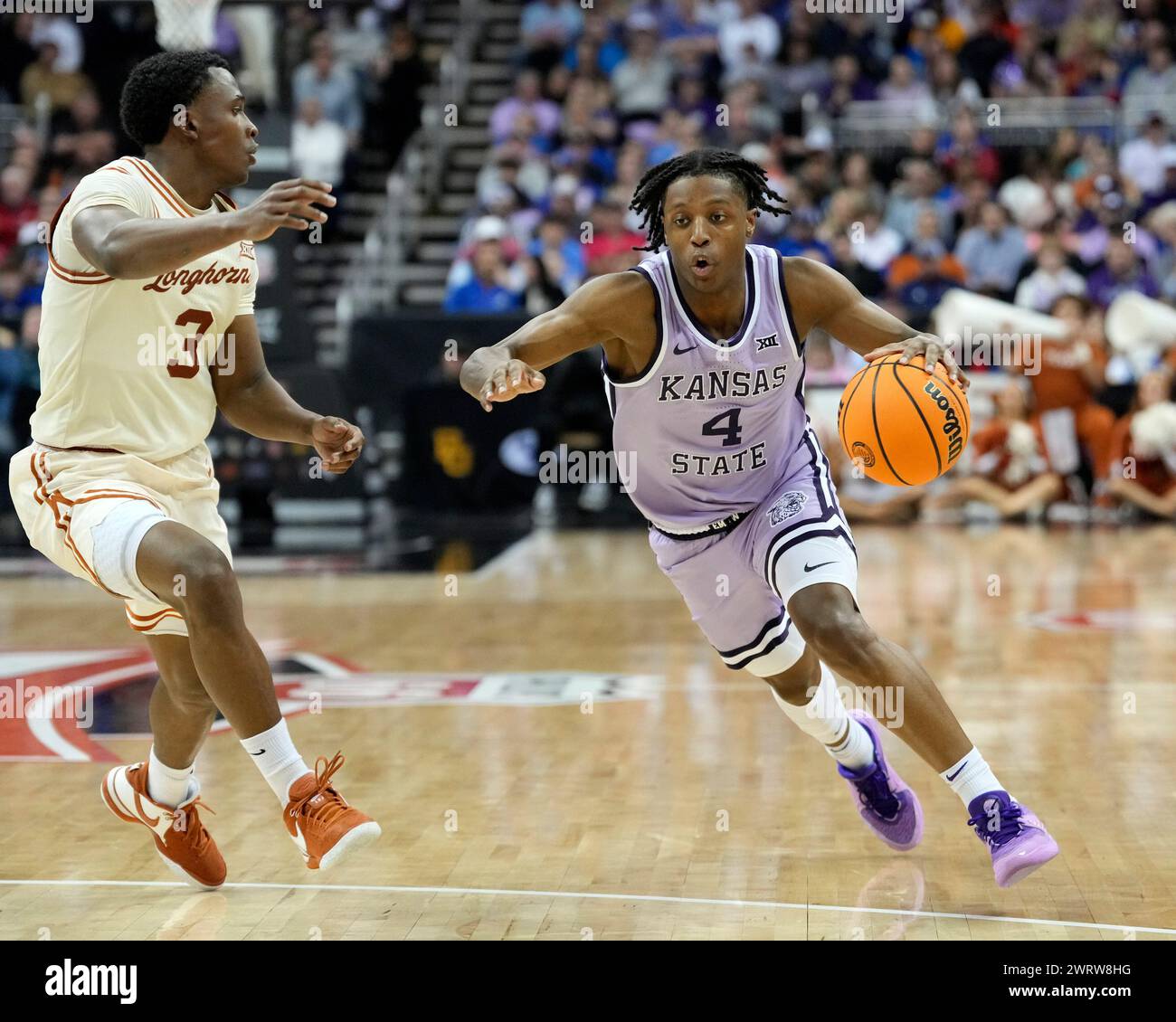MAR 13 2024: Kansas State Wildcats guard Dai Dai Ames (4) drives around ...