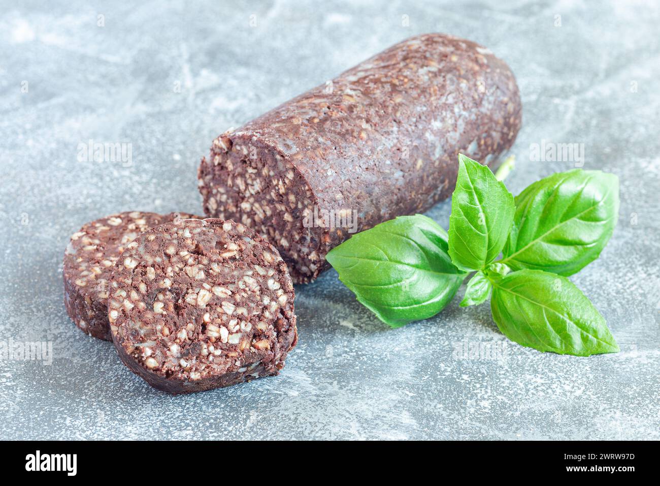 Traditional Irish and British black pudding sausage slices, basil ...